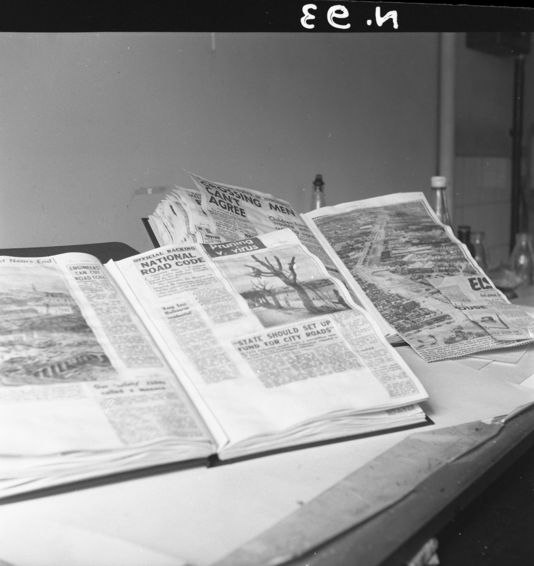 N93 Image showing newspaper clippings pasted into books - City Collection
