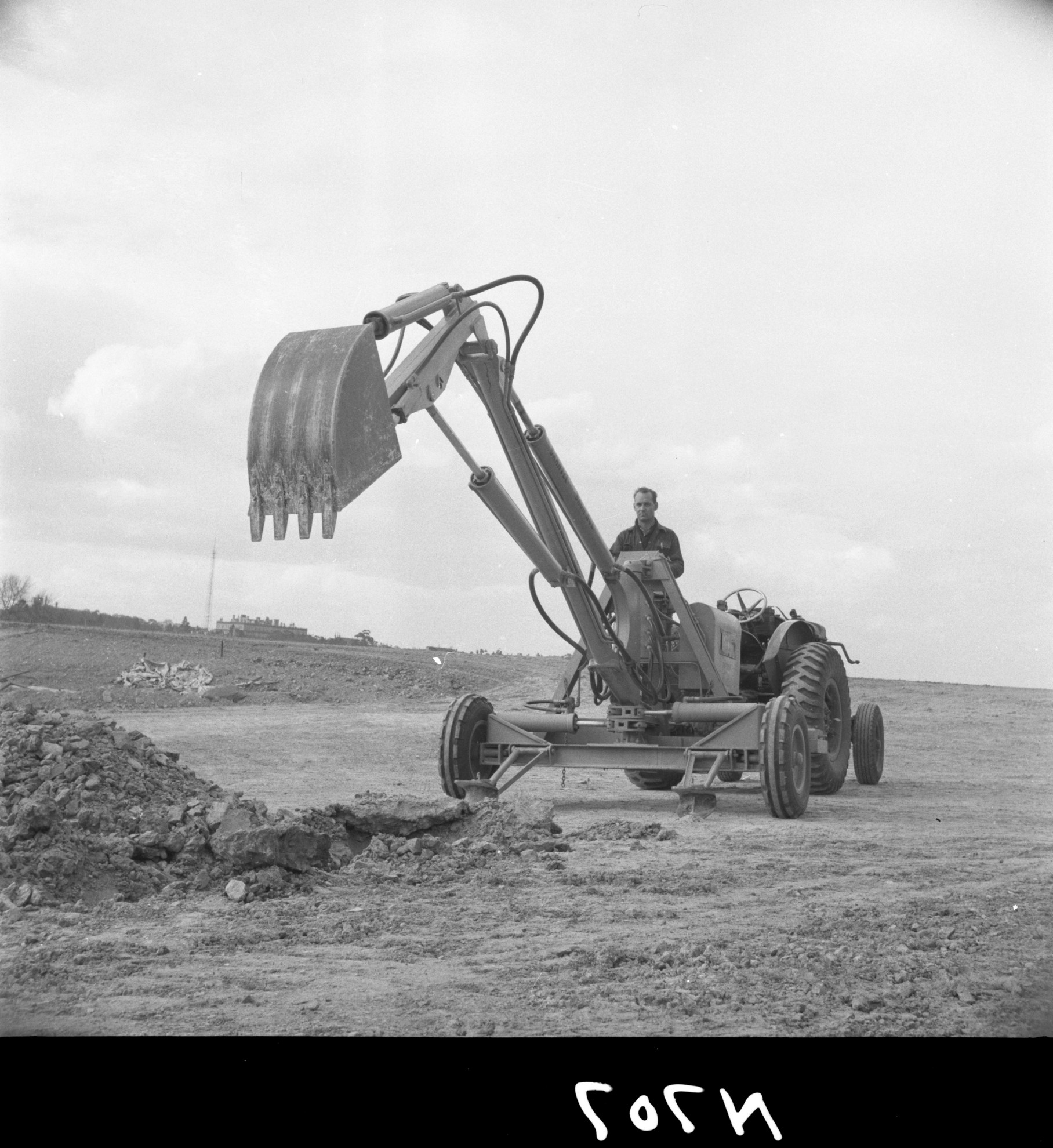 N707 Image of a back-hoe earth remover - City Collection