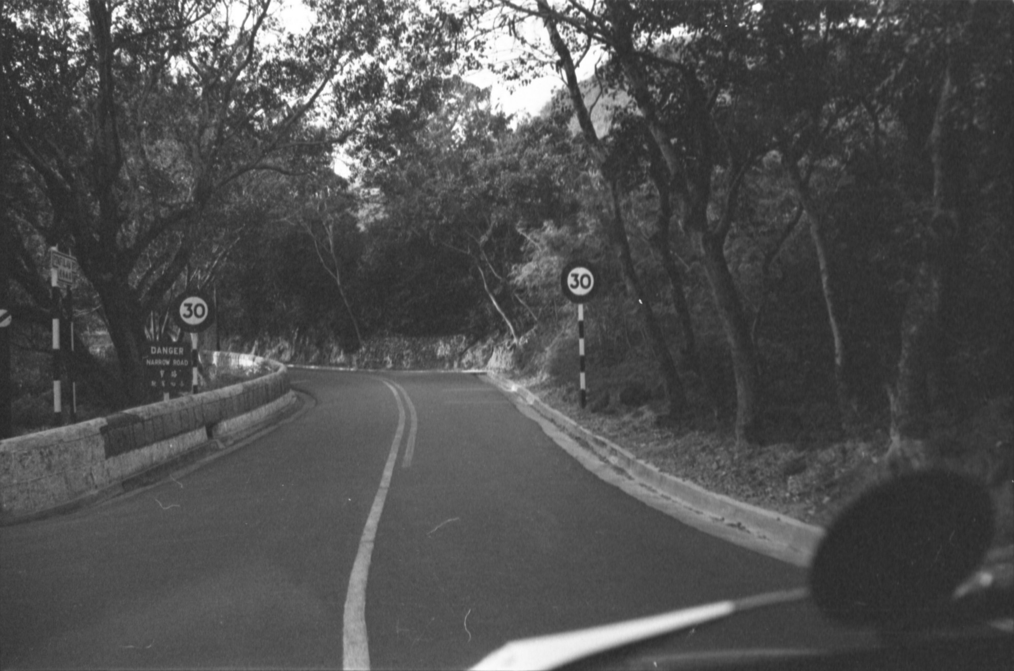 35A-25f Image of a road in Hong Kong, with speed limit signs and a sign ...