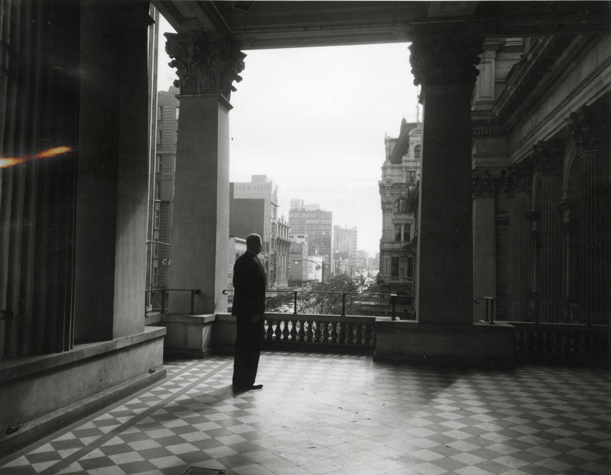 Image of a man on the upper level of Melbourne Town Hall's portico ...